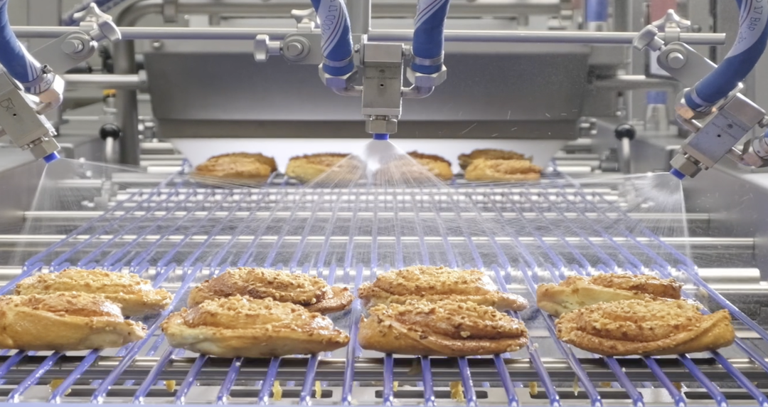 Food spraying machine for bakery & food production - Coperion